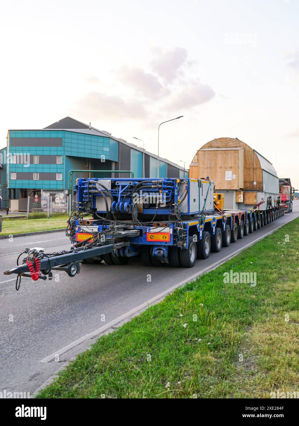 Very long specialized multi axle truck trailer carries very heavy ...