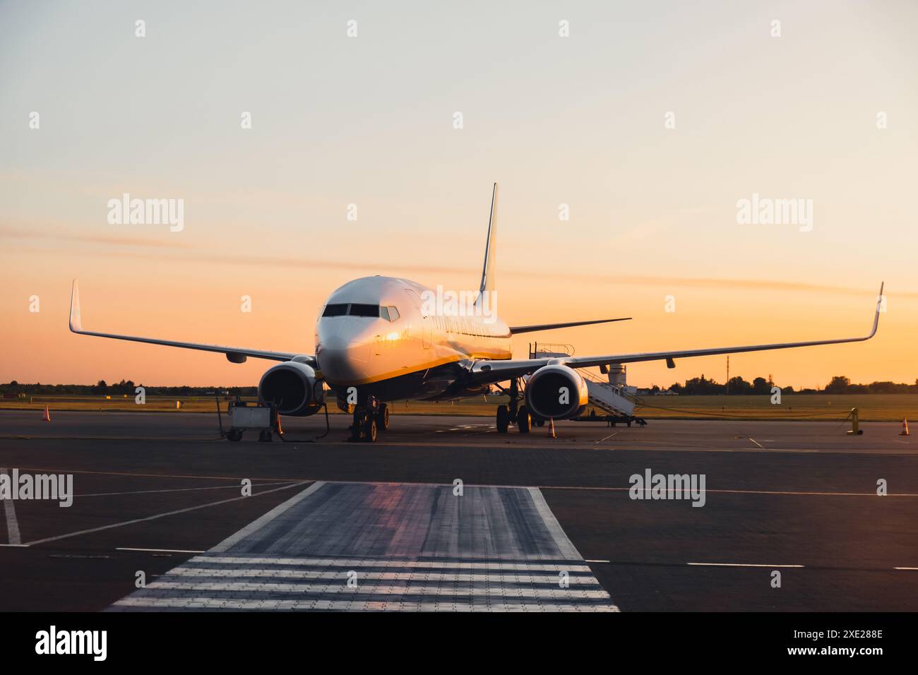 Airplane at the terminal ready to take off. World travel concept. Low ...
