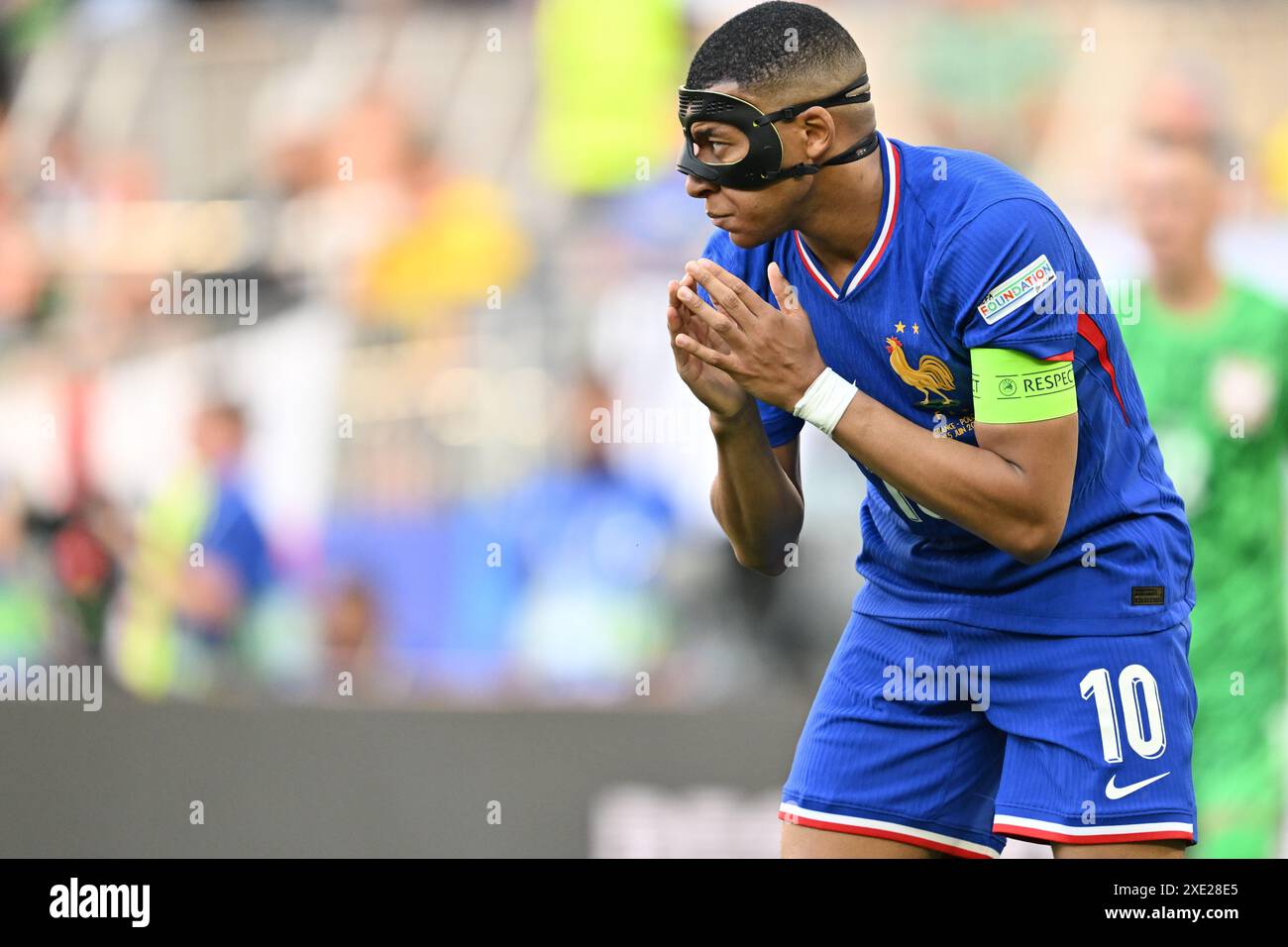 Kylian Mbappe (10) of France in pain after being hit on the nose during ...