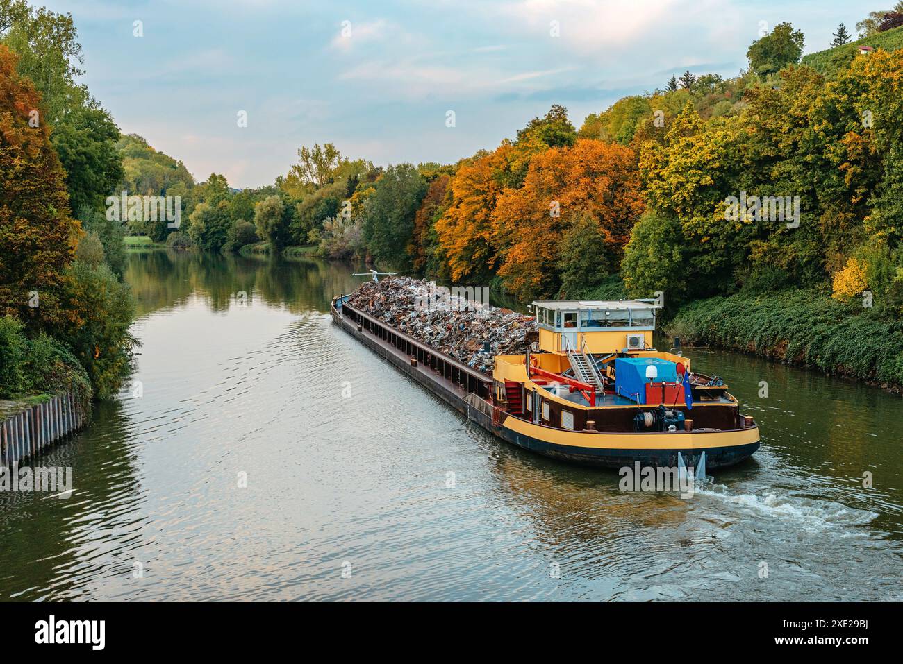 Transportation industry. Ship barge transports scrap metal and sand ...