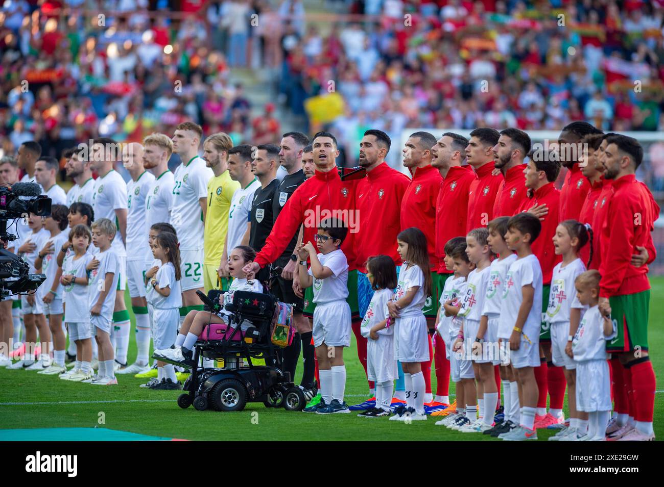 Cristiano Ronaldo entering the pitch with a child Stock Photo - Alamy