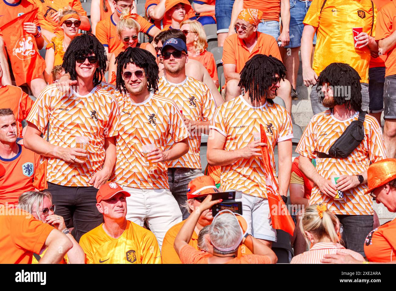 BERLIN, GERMANY - JUNE 25: Fans of the Netherlands with a wig in ...