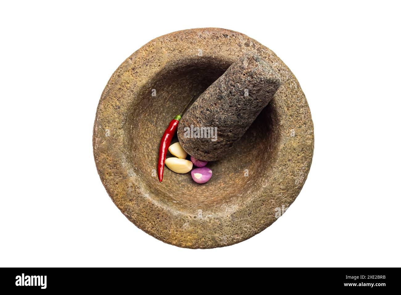 Top view of old used rock mortar with pestle and red chili, onion and ...