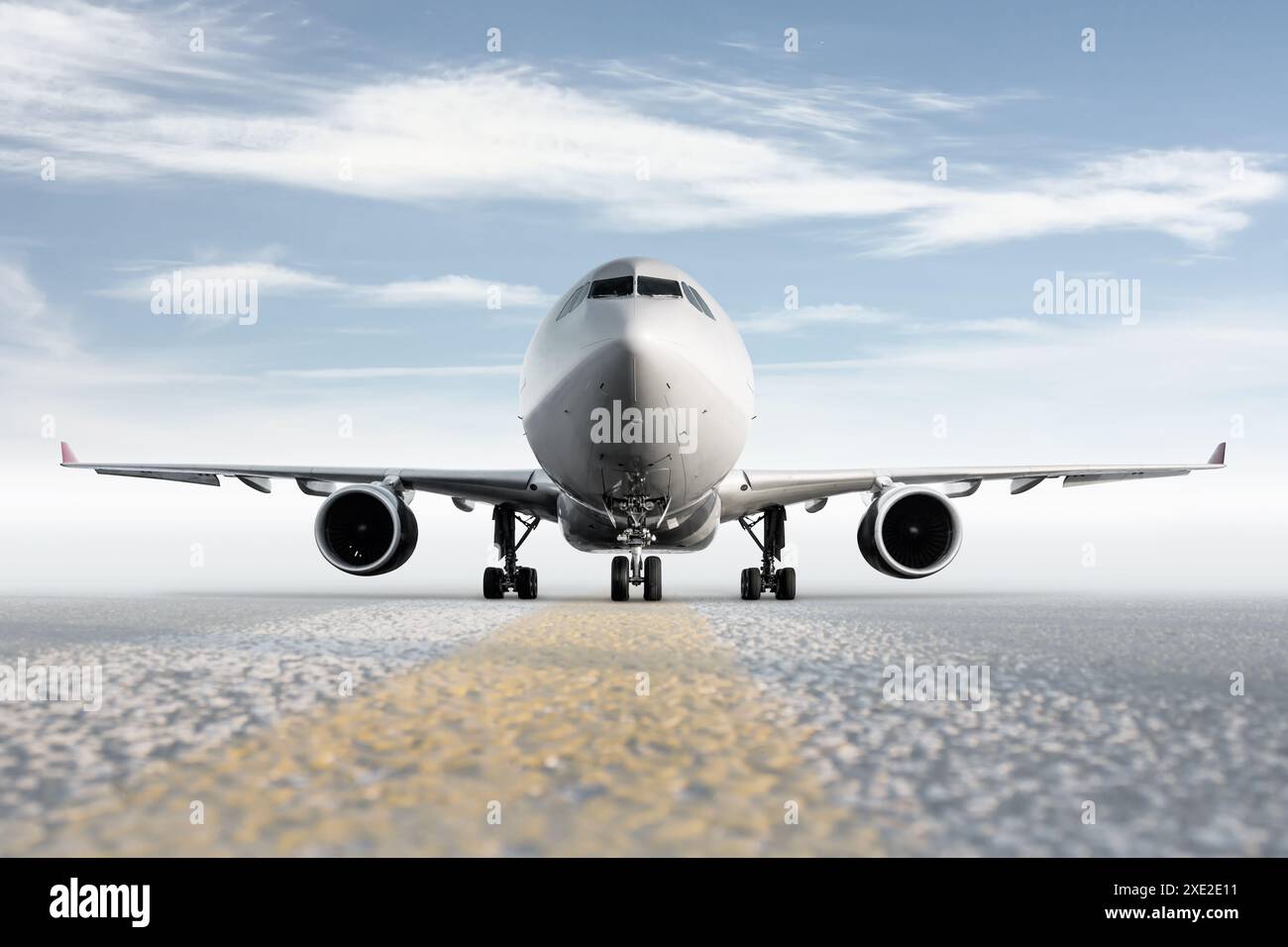 Front view of wide body passenger aircraft isolated on bright ...