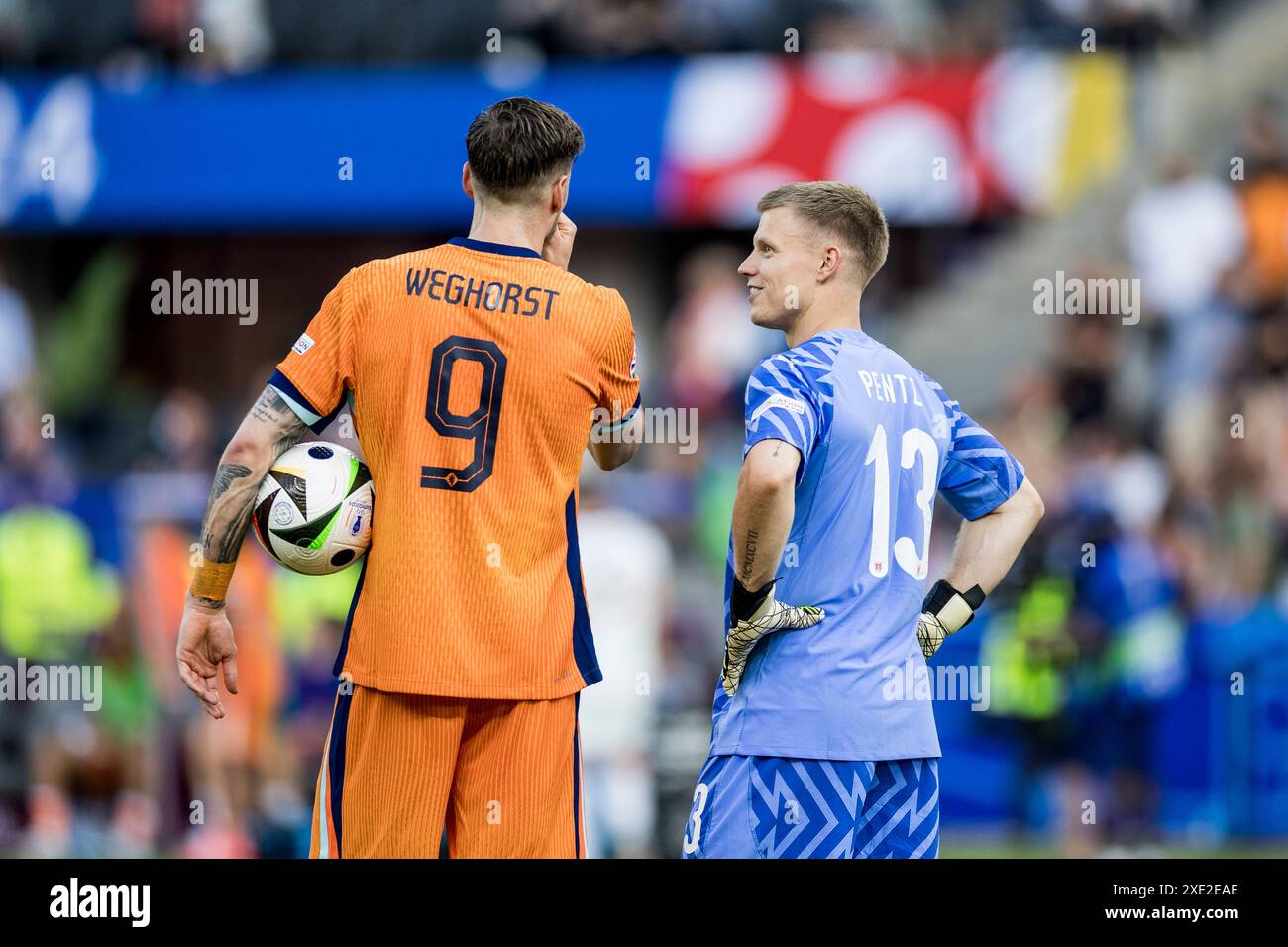Berlin, Germany. 25th, June 2024. Wout Weghorst (9) of Netherlands and goalkeeper Patrick Pentz ...