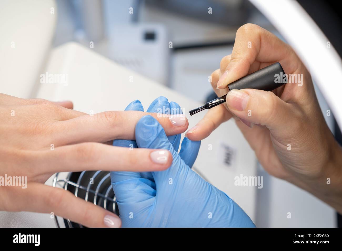 Female hands and tools for manicure, process of performing manicure ...