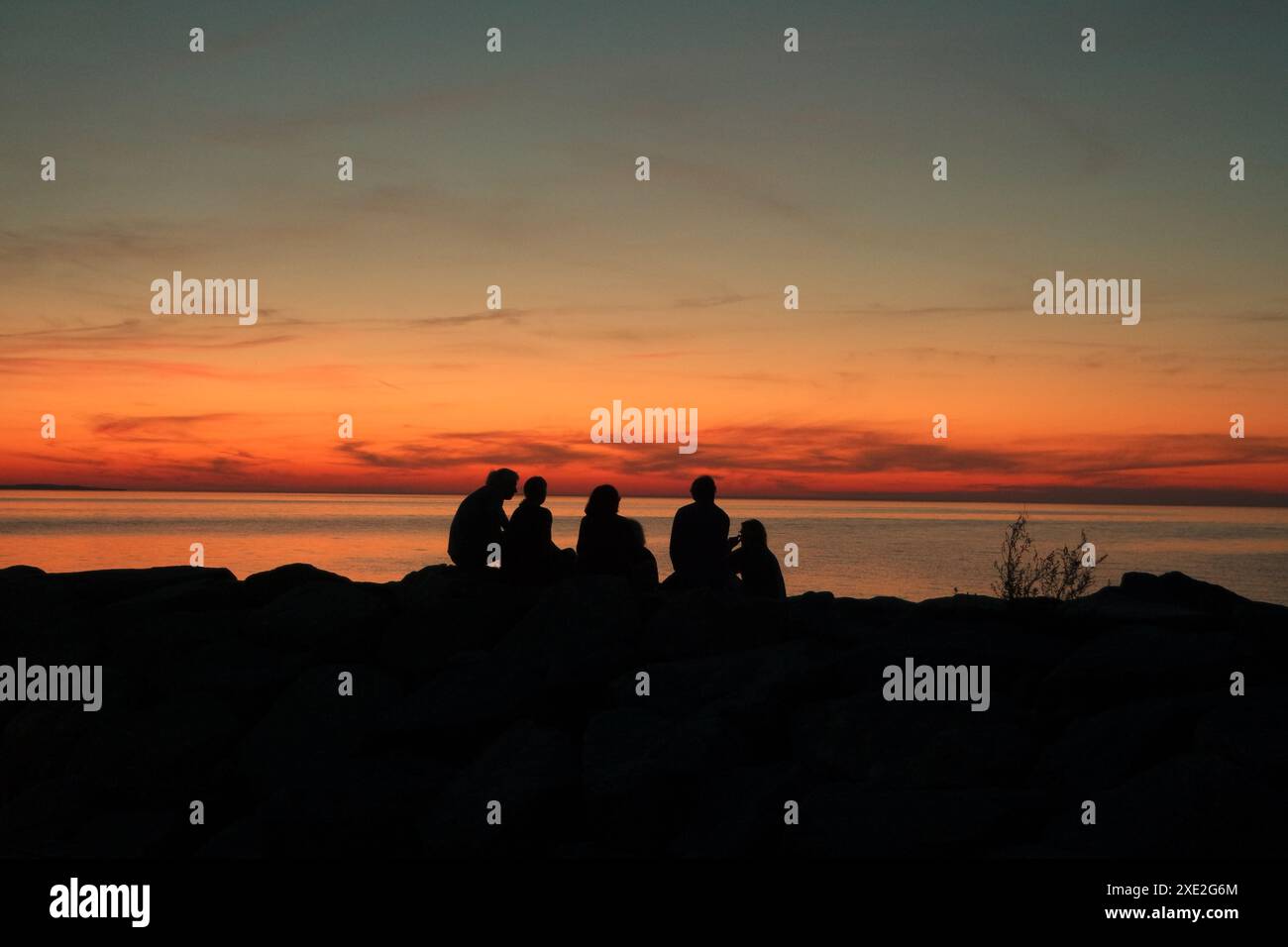 Enjoy the sunset together Stock Photo - Alamy