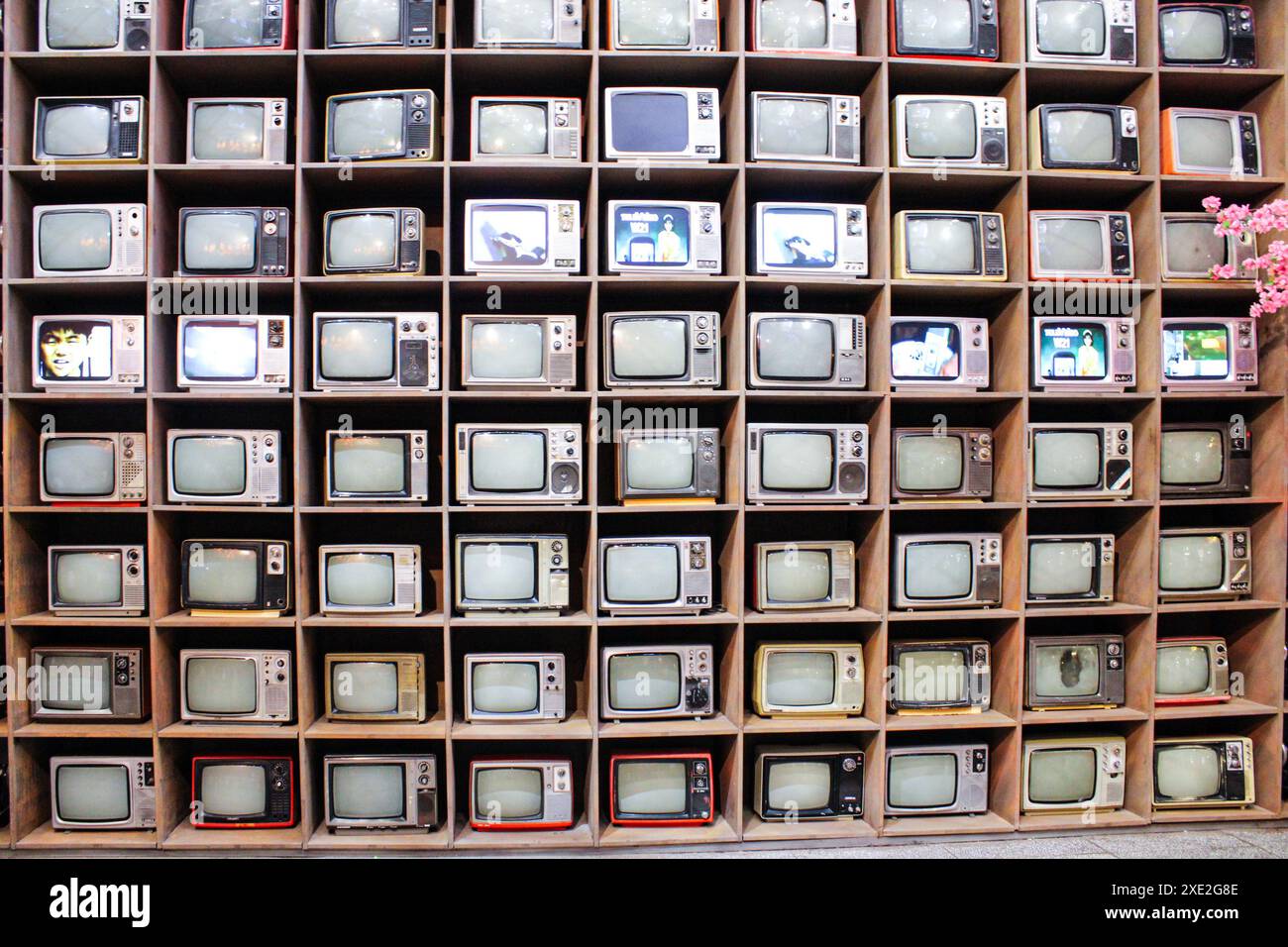 Beijing, China - June 17, 2024: Wall of old tube TVs. A background of ...
