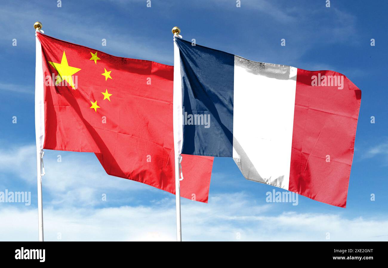Chinese flag, French flag under cloudy sky. flying in the sky Stock ...