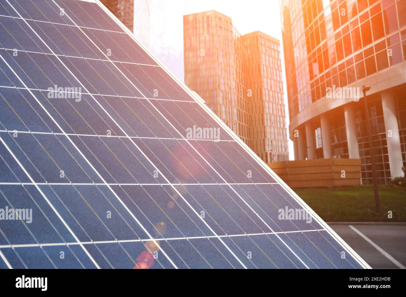 Element of a solar power plant against the background of a modern city ...