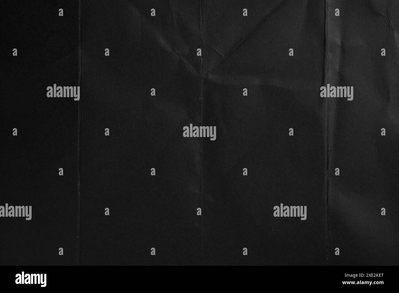 Cardboard sheet with black textured creased surface revealing subtle ...