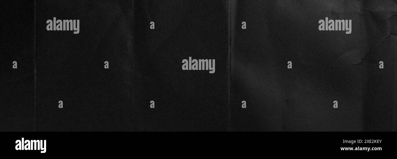 Crumpled black aged paper poster with frayed folds. Dusty cardboard ...