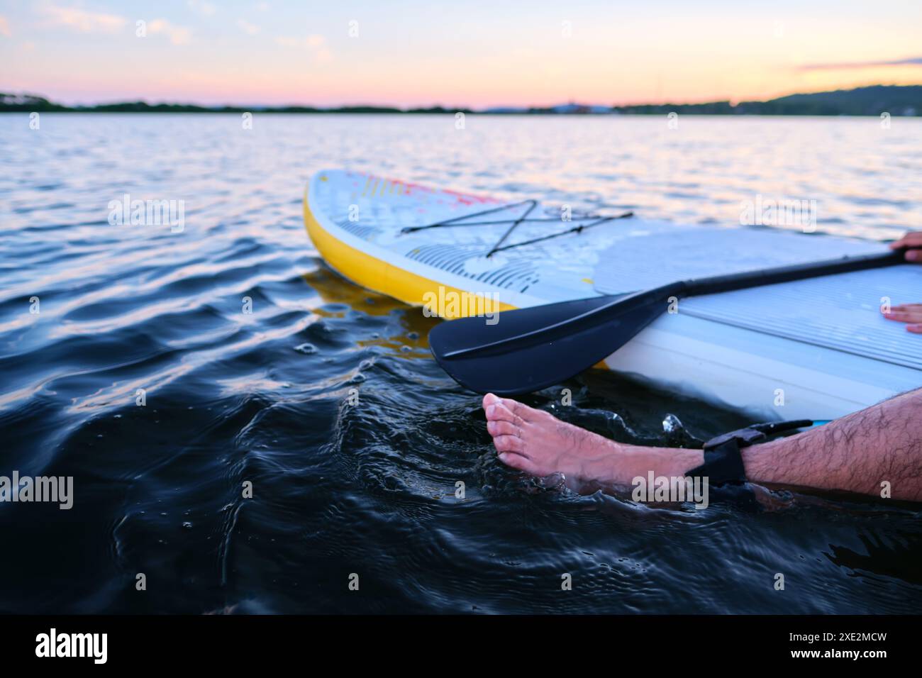 Sup board wetsuit hi-res stock photography and images - Alamy