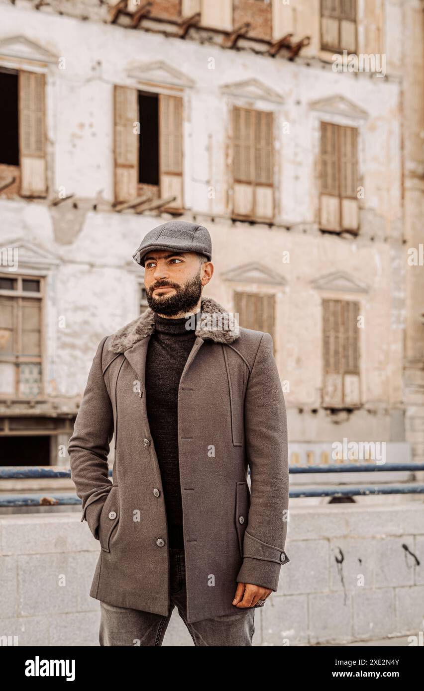 a handsome man in elegant clothes, with a distinctive old antique house ...