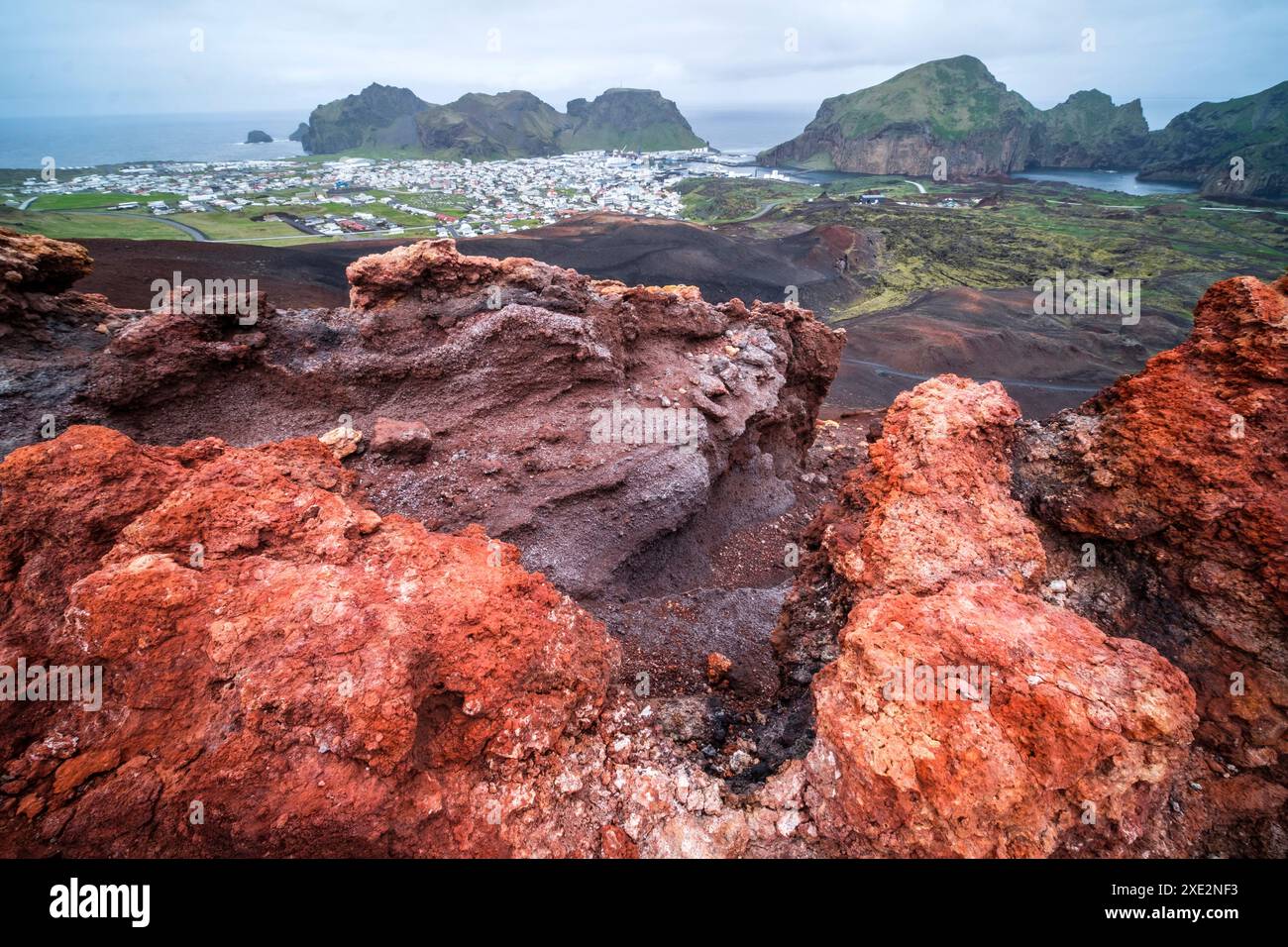 The city of Heimaey and the haven are located at the foot of the ...