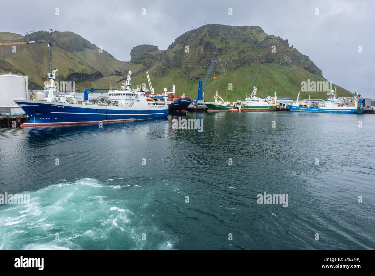 The city of Heimaey and the haven are located at the foot of the ...