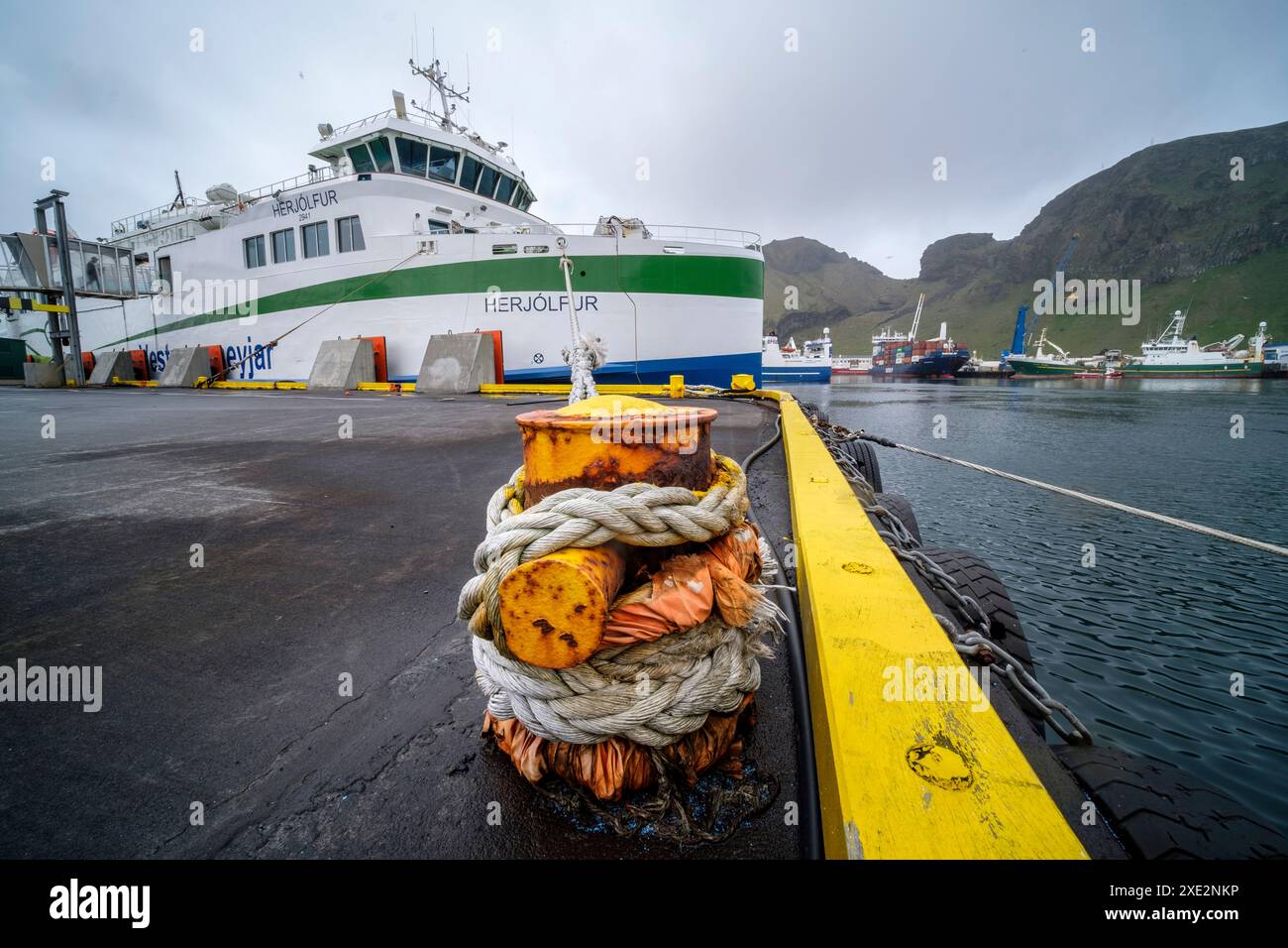 The city of Heimaey and the haven are located at the foot of the ...