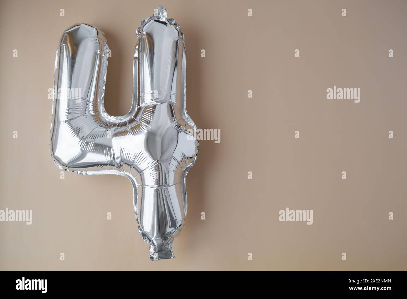 4 four metallic balloon on beige neutral background. Greeting card ...