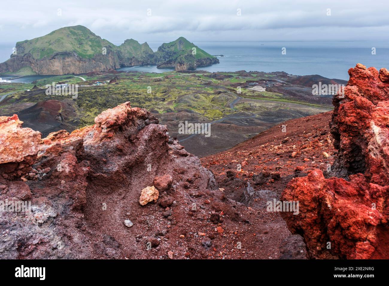 The city of Heimaey and the haven are located at the foot of the ...