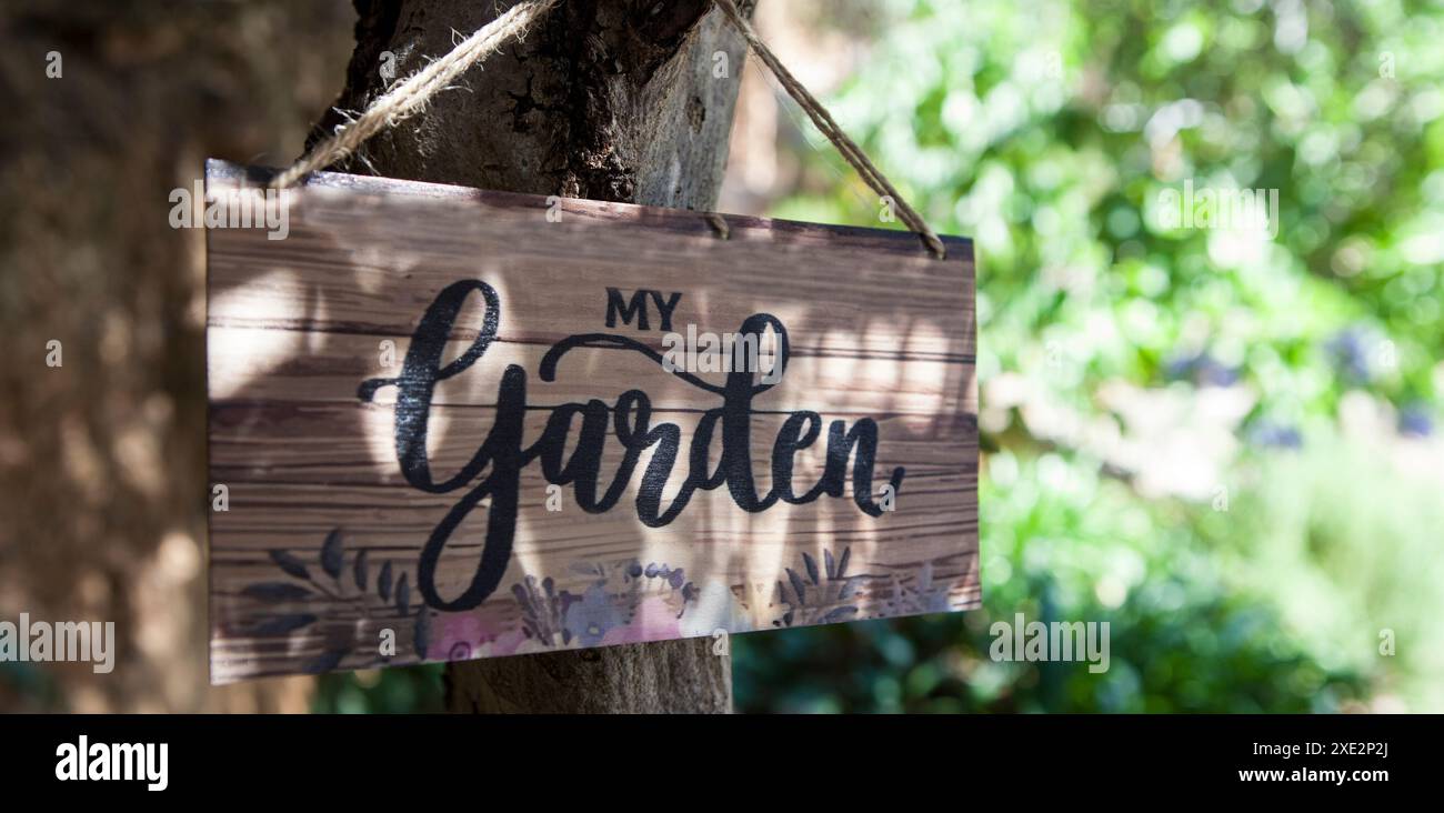 Garden sign with mediterranean courtyard as background. English ...