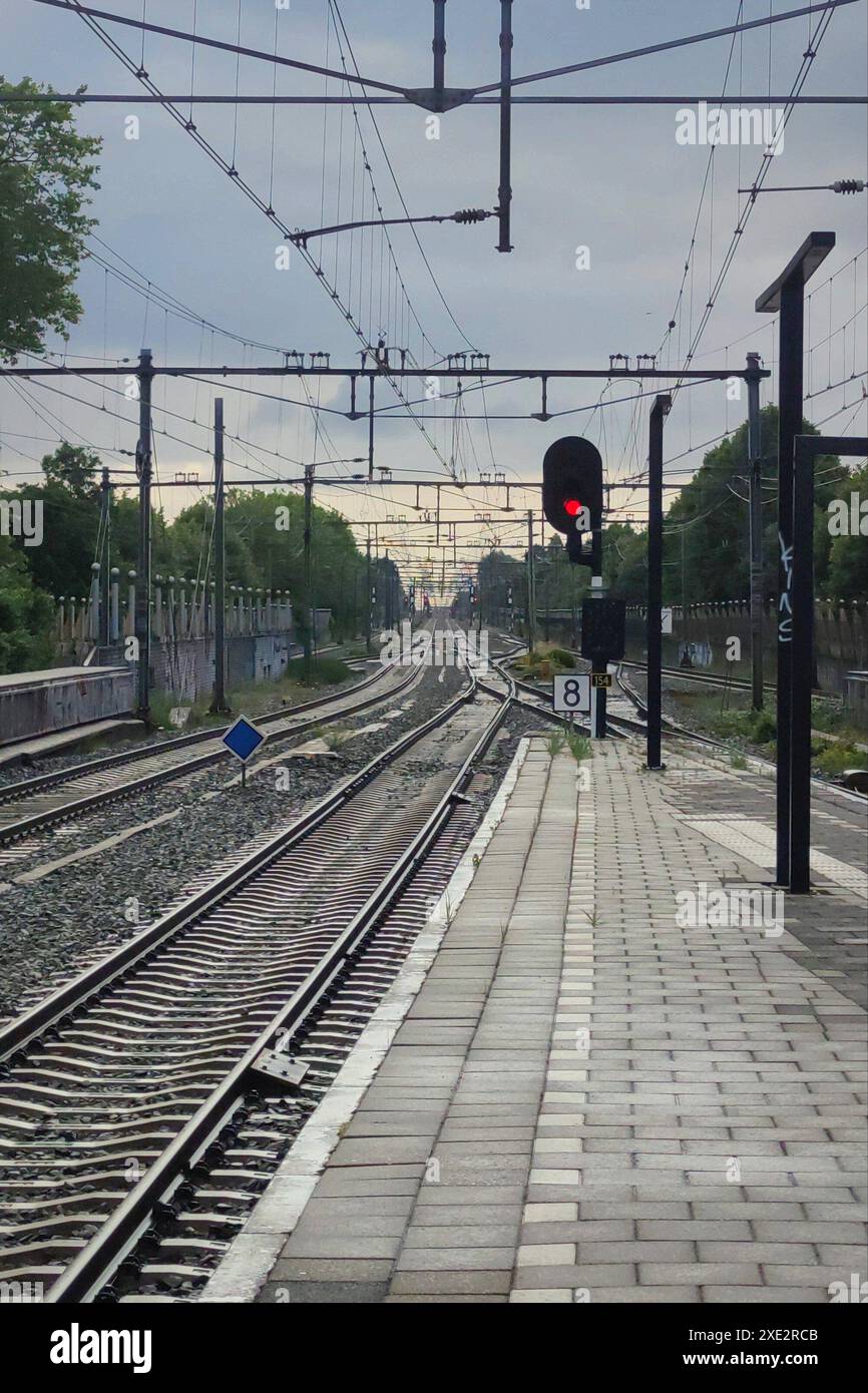 Converging Railroad Tracks. Railroad tracks are converging, as seen ...