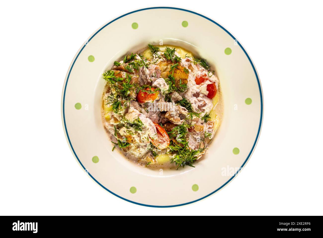 Cod fish with mashed potatoes and pieces of tomatoes in white ceramic ...