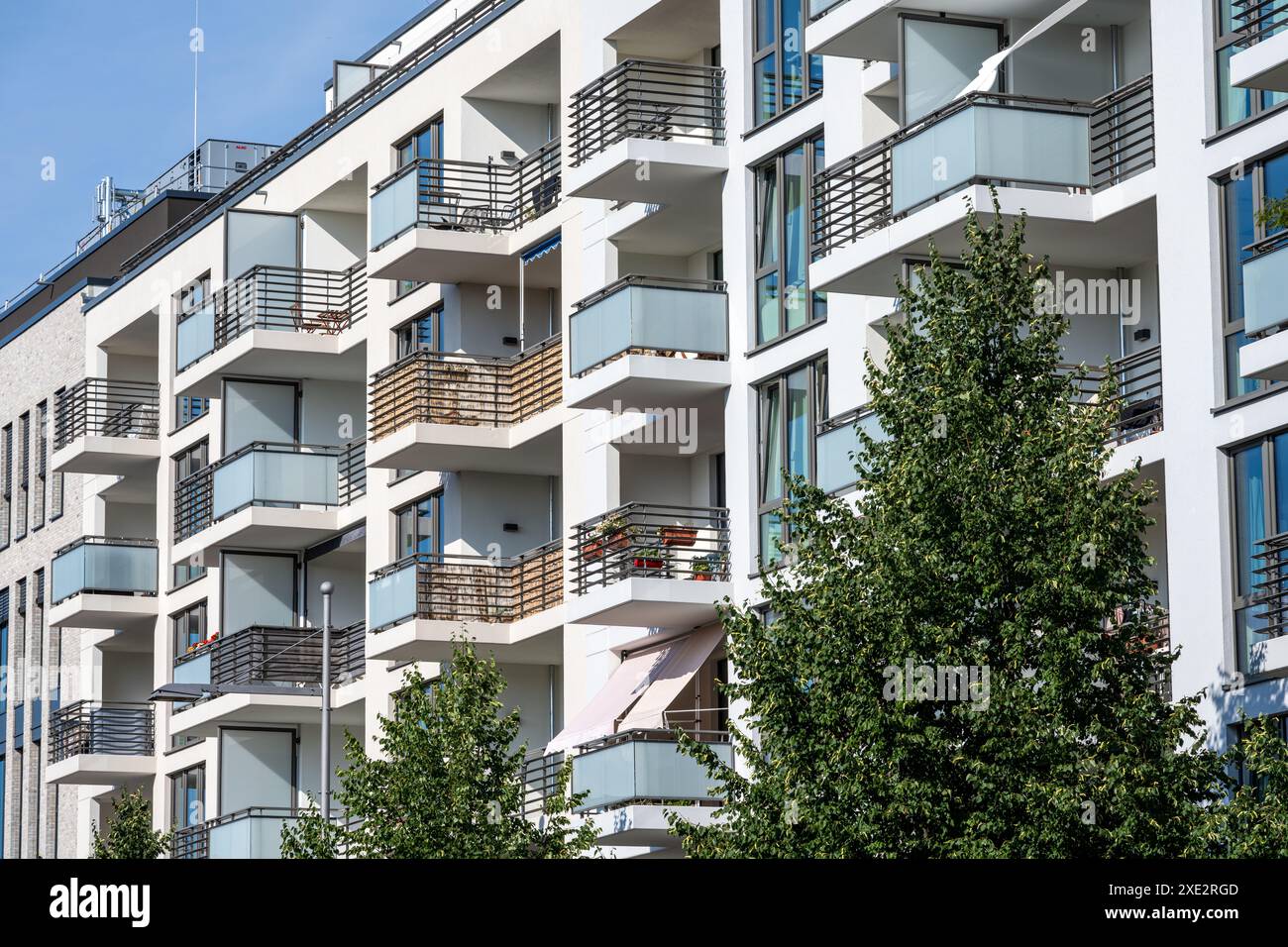 Apartment building with green trees seen in Berlin, Germany Stock Photo ...