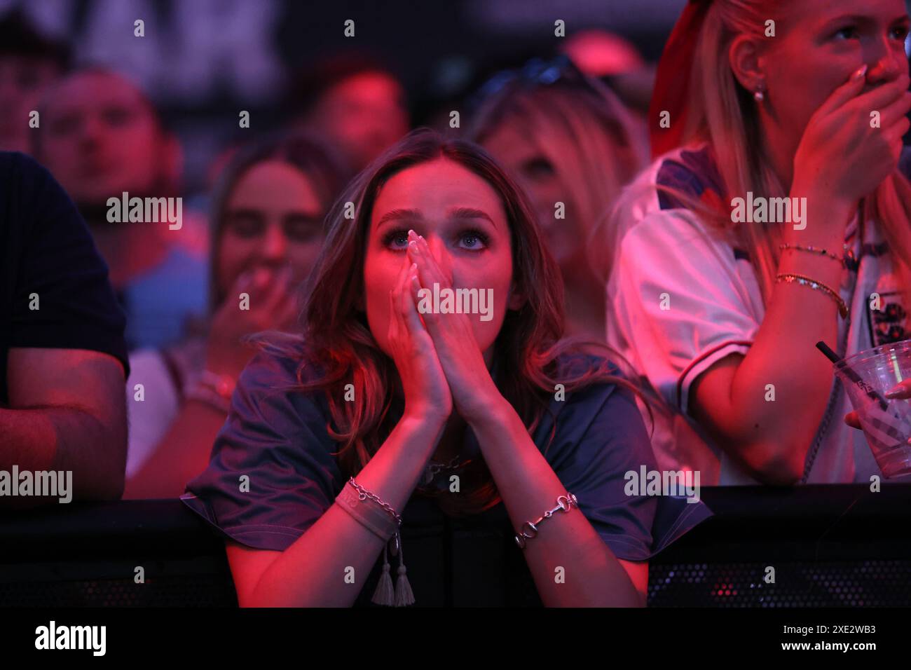England fans at BOXPark Wembley in London react watching the UEFA Euro ...