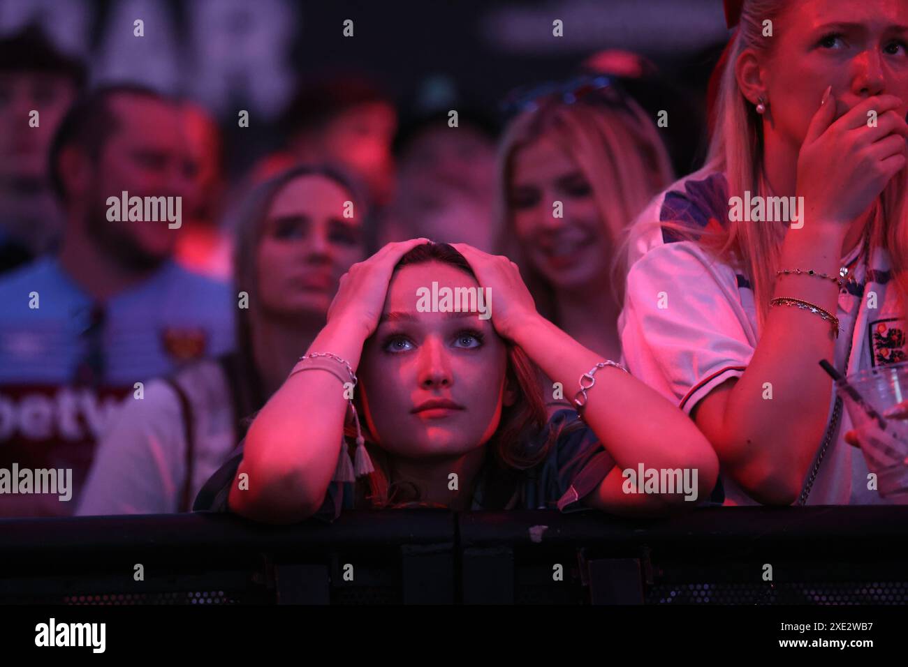 England fans at BOXPark Wembley in London react watching the UEFA Euro ...