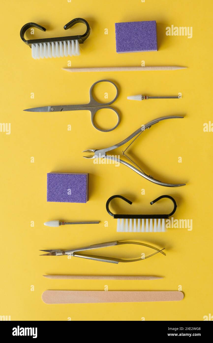 Professional manicure tools on yellow background. Manicure set Stock ...