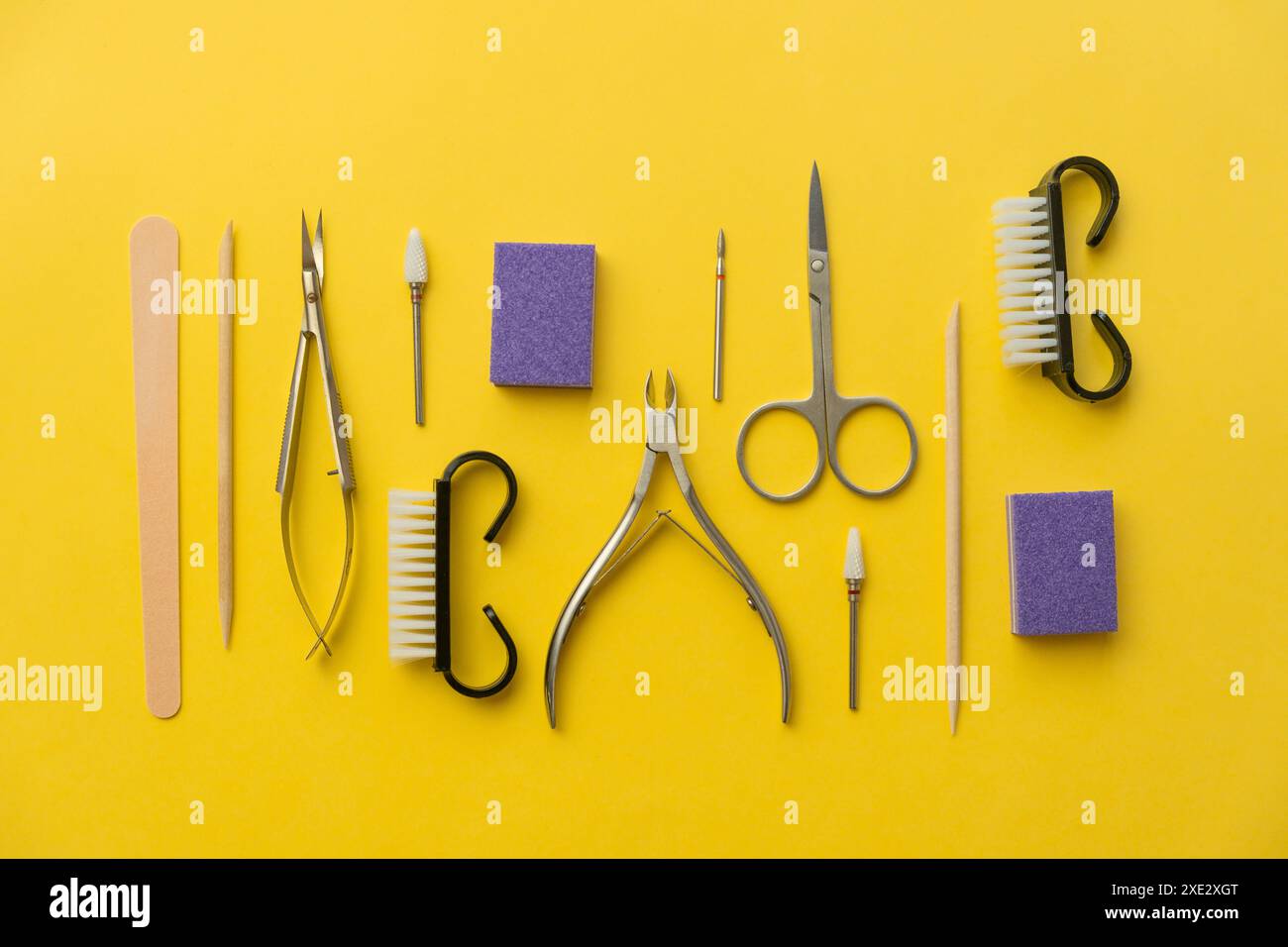 Professional manicure tools on yellow background. Manicure set Stock ...