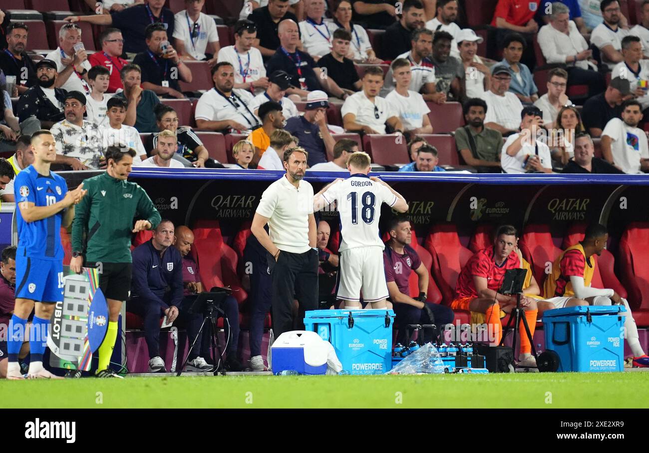 England manager Gareth Southgate and Anthony Gordon on the touchline ...