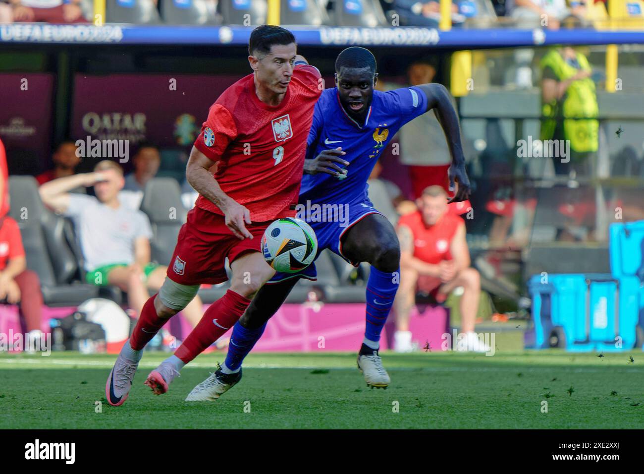 Robert Lewandowski of Poland in action against Dayot Upamecano of ...