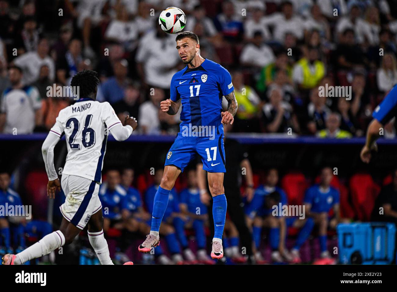 COLOGNE, GERMANY - JUNE 25: Jan Mlakar of Slovenia heads the ball ...