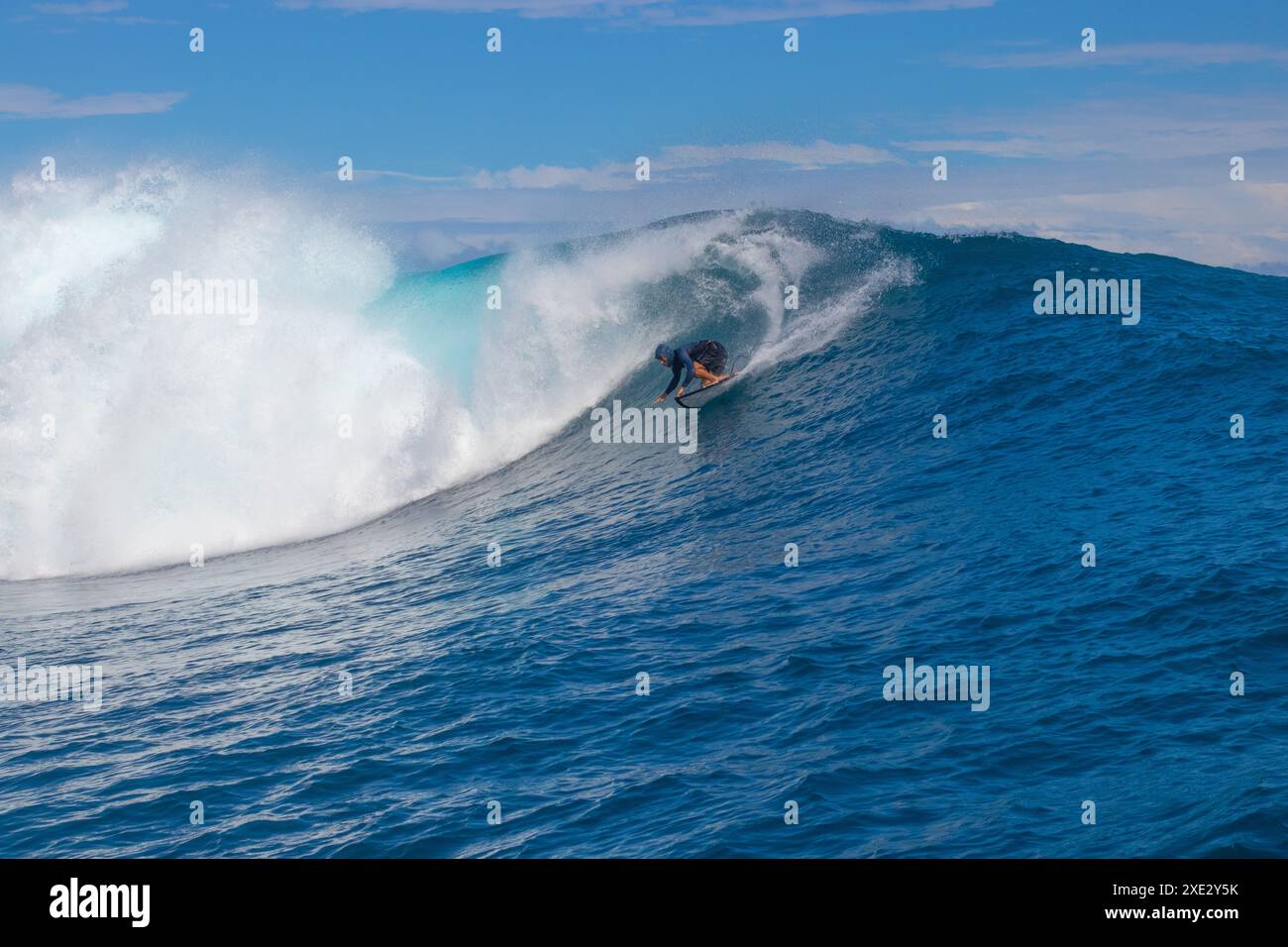 Teahupoo, Tahiti, French Polynesia - June 7, 2024 - a surfer tackling a ...