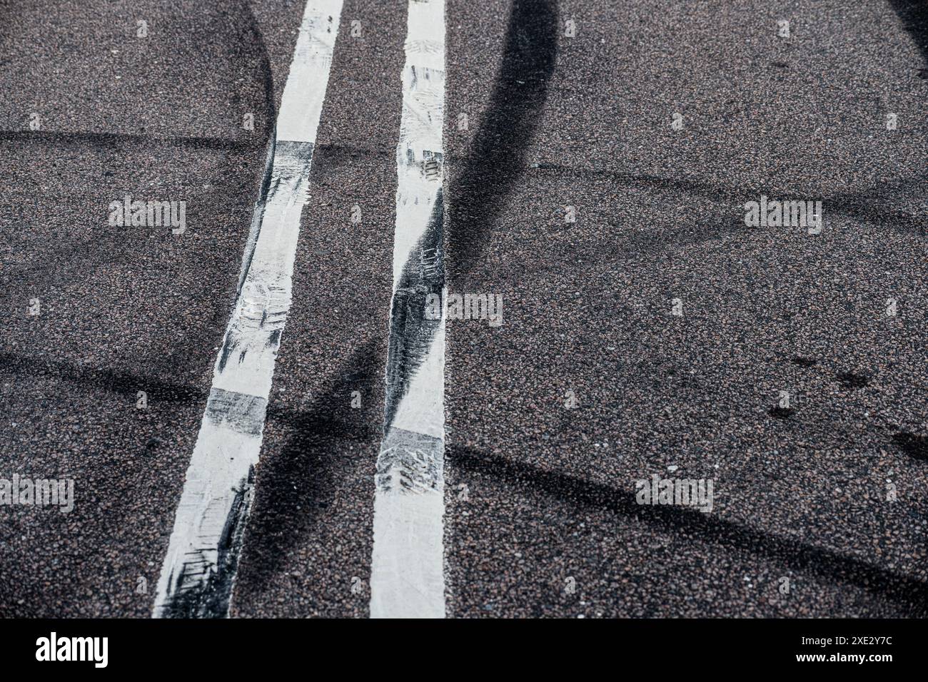 Black rubber tire marks in a street Stock Photo - Alamy