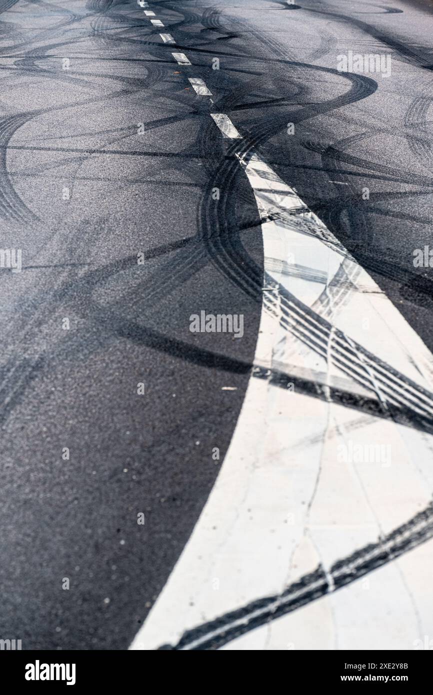 Black rubber tire marks in a street Stock Photo - Alamy