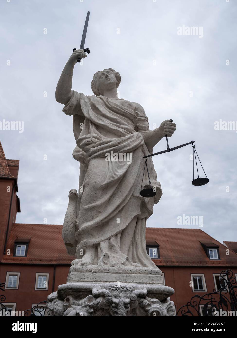 Regensburg, Germany. 12th June, 2024. A stone statue of Justitia with a ...