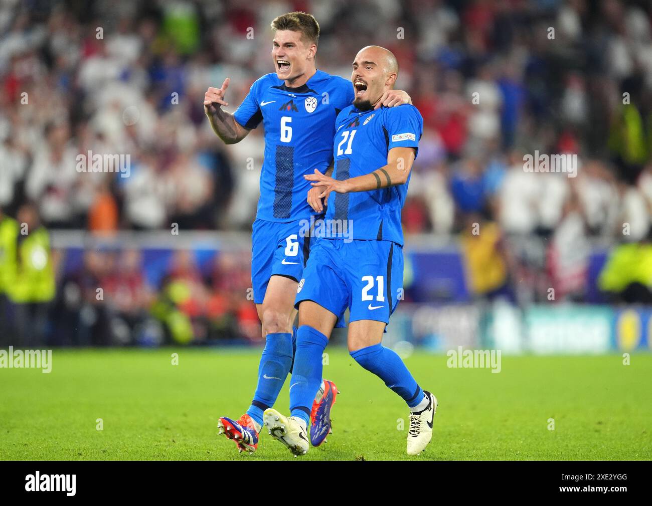 Slovenia's Jaka Bijol and Vanja Drkusic react following the UEFA Euro ...