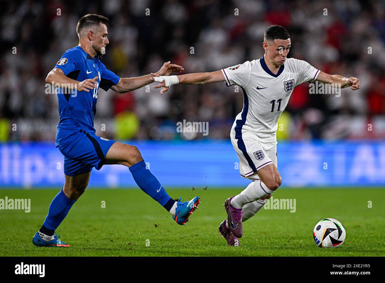 COLOGNE, GERMANY - JUNE 25: Timi Elsnik of Slovenia, Phil Foden of ...