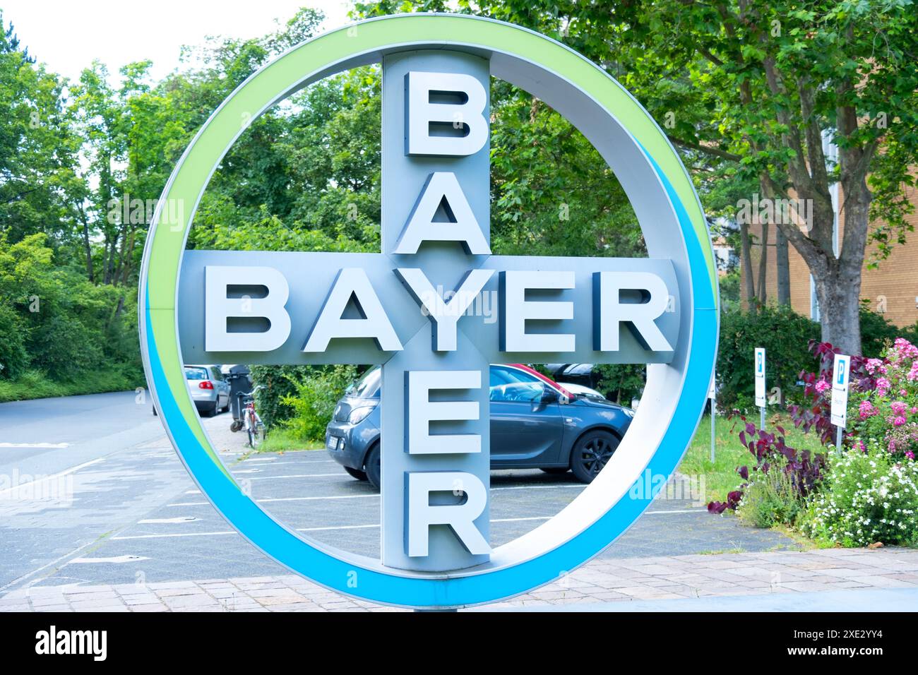 Bayer logo and Consumer Health Division sign, pharmaceutical industry ...