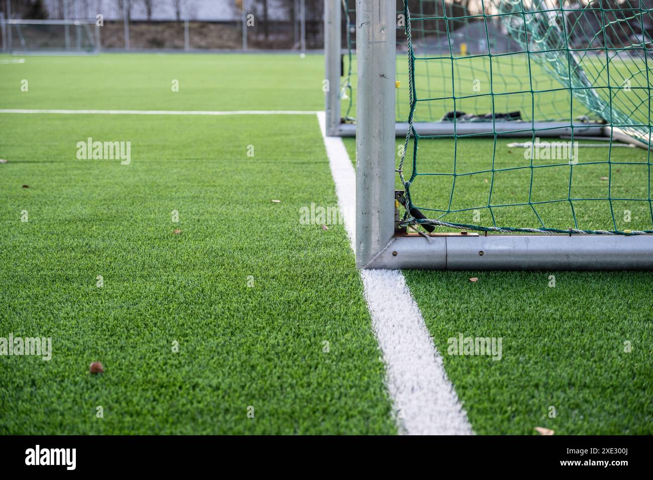 White markings and goal post of an artificial turf football field Stock ...