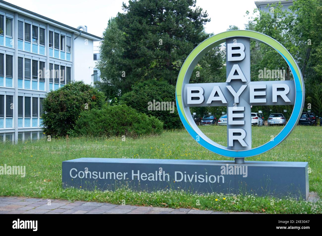 Bayer logo and Consumer Health Division sign, pharmaceutical industry ...
