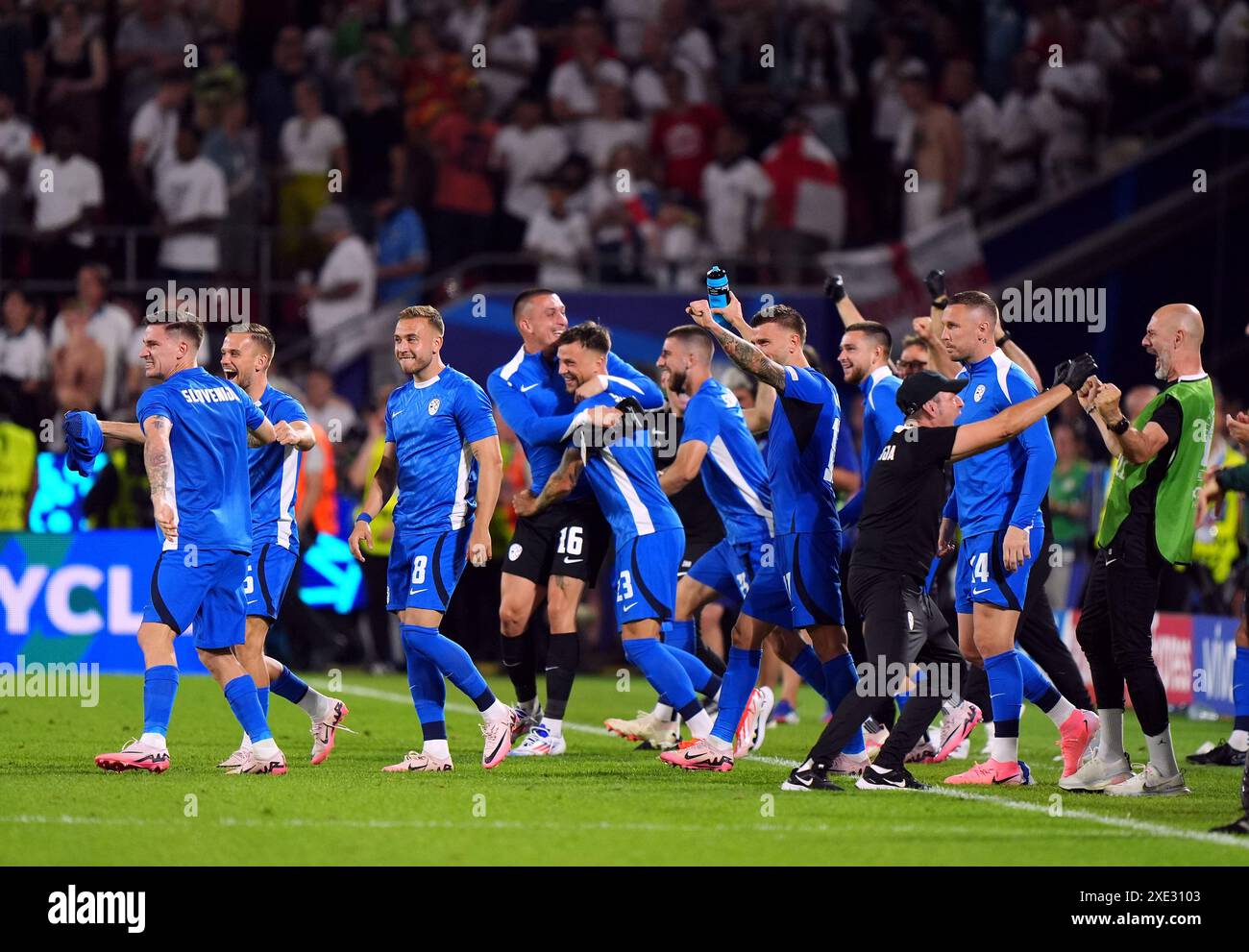 Slovenia players celebrate qualifying for the next round after the UEFA ...
