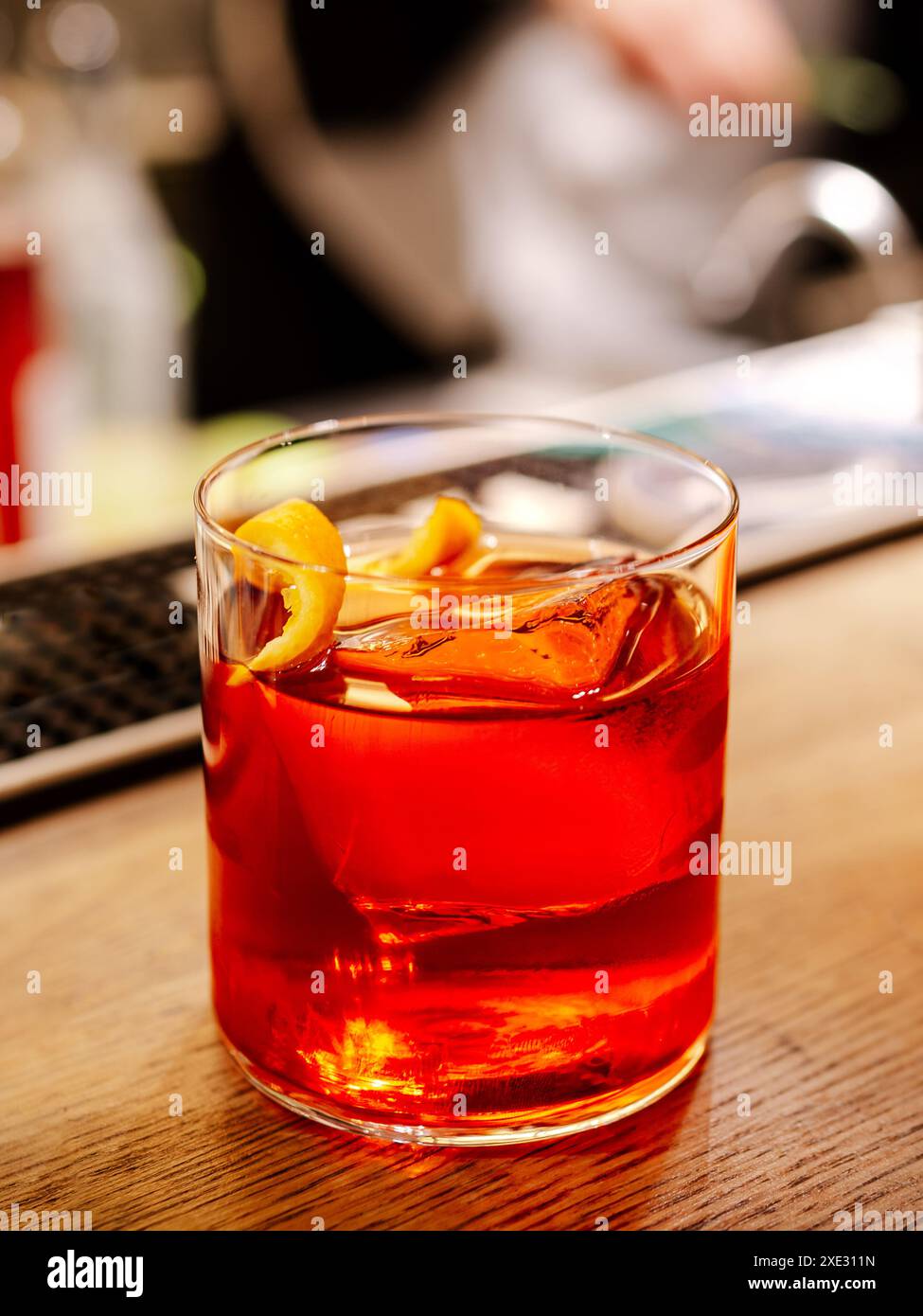 Negroni cocktail on bar counter Stock Photo - Alamy
