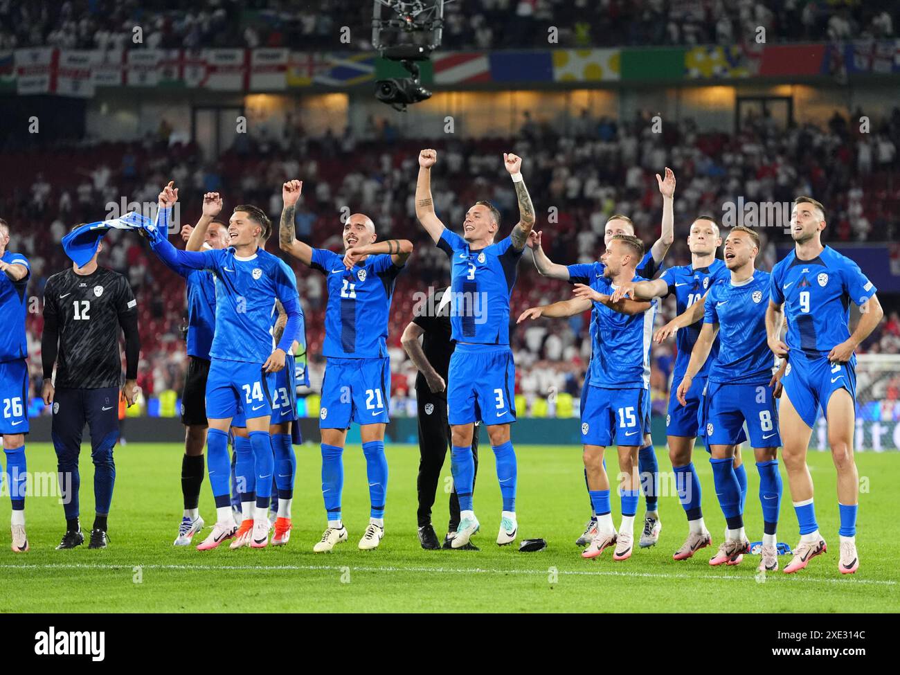 Slovenia players celebrate reaching the round of 16 following the UEFA ...