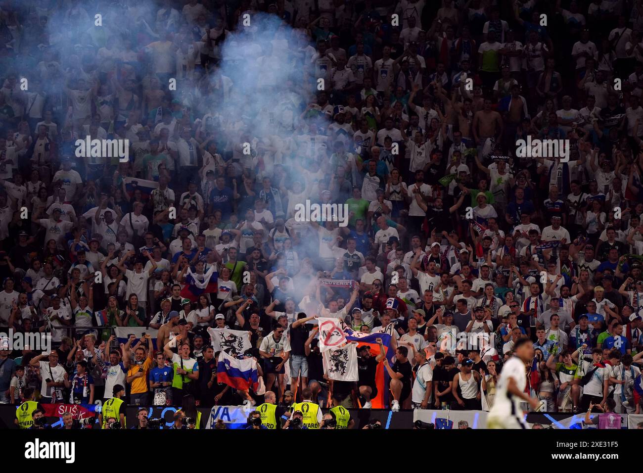 Slovenia fans celebrate qualifying for the next round after the UEFA ...