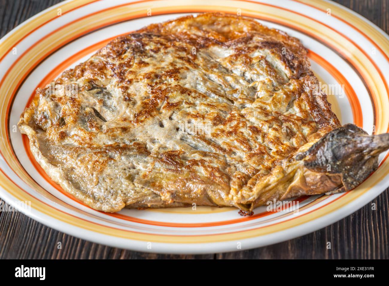 Tortang Talong filipino eggplant omelette on the plate Stock Photo - Alamy