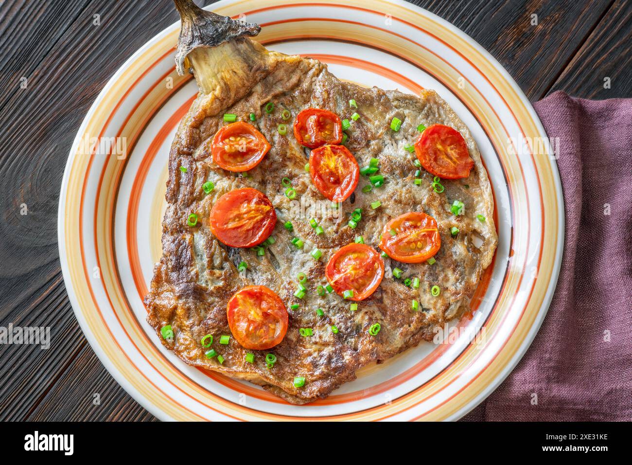 Tortang Talong filipino eggplant omelette on the plate Stock Photo - Alamy