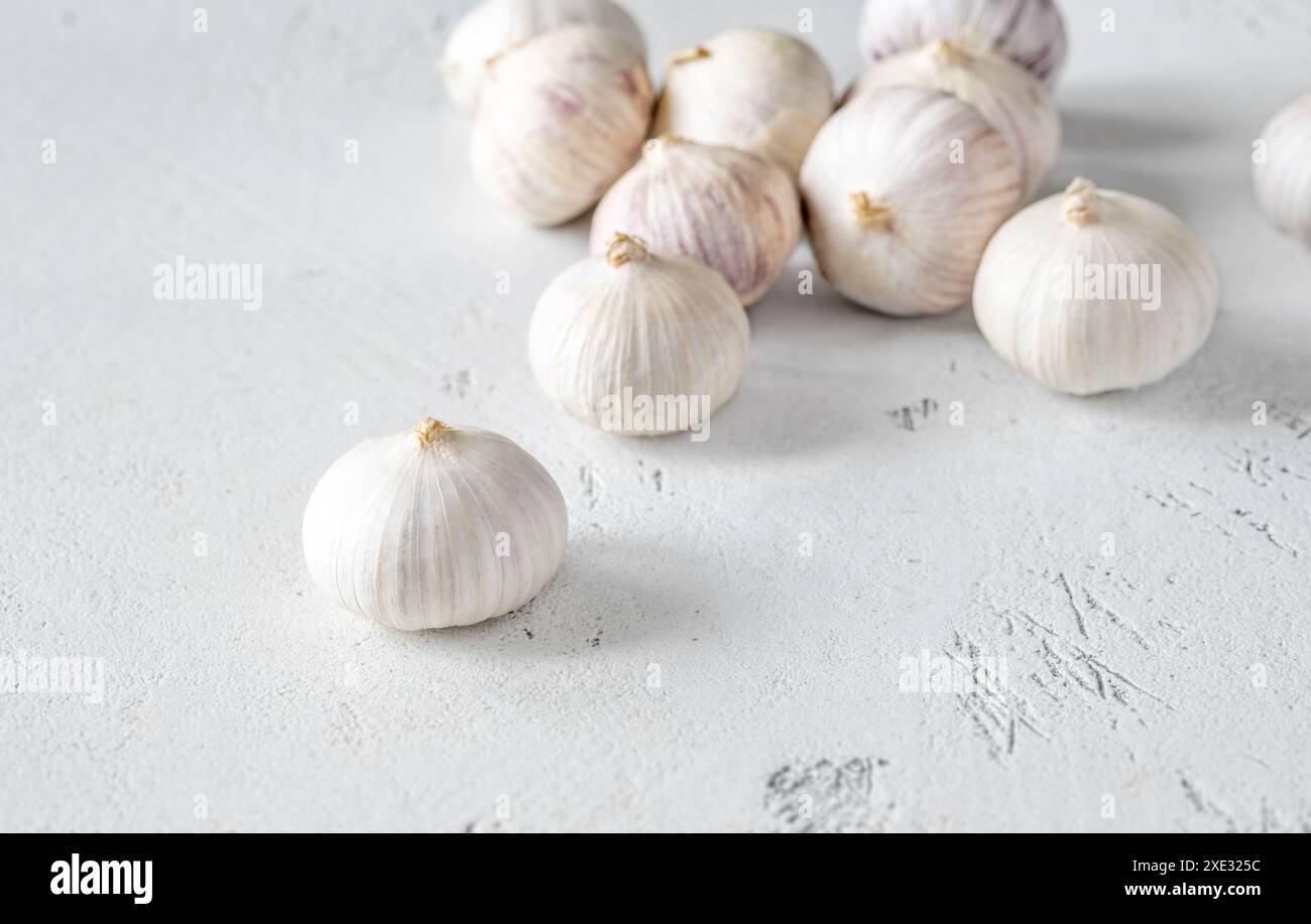 Bunch of solo garlic on the white background Stock Photo - Alamy